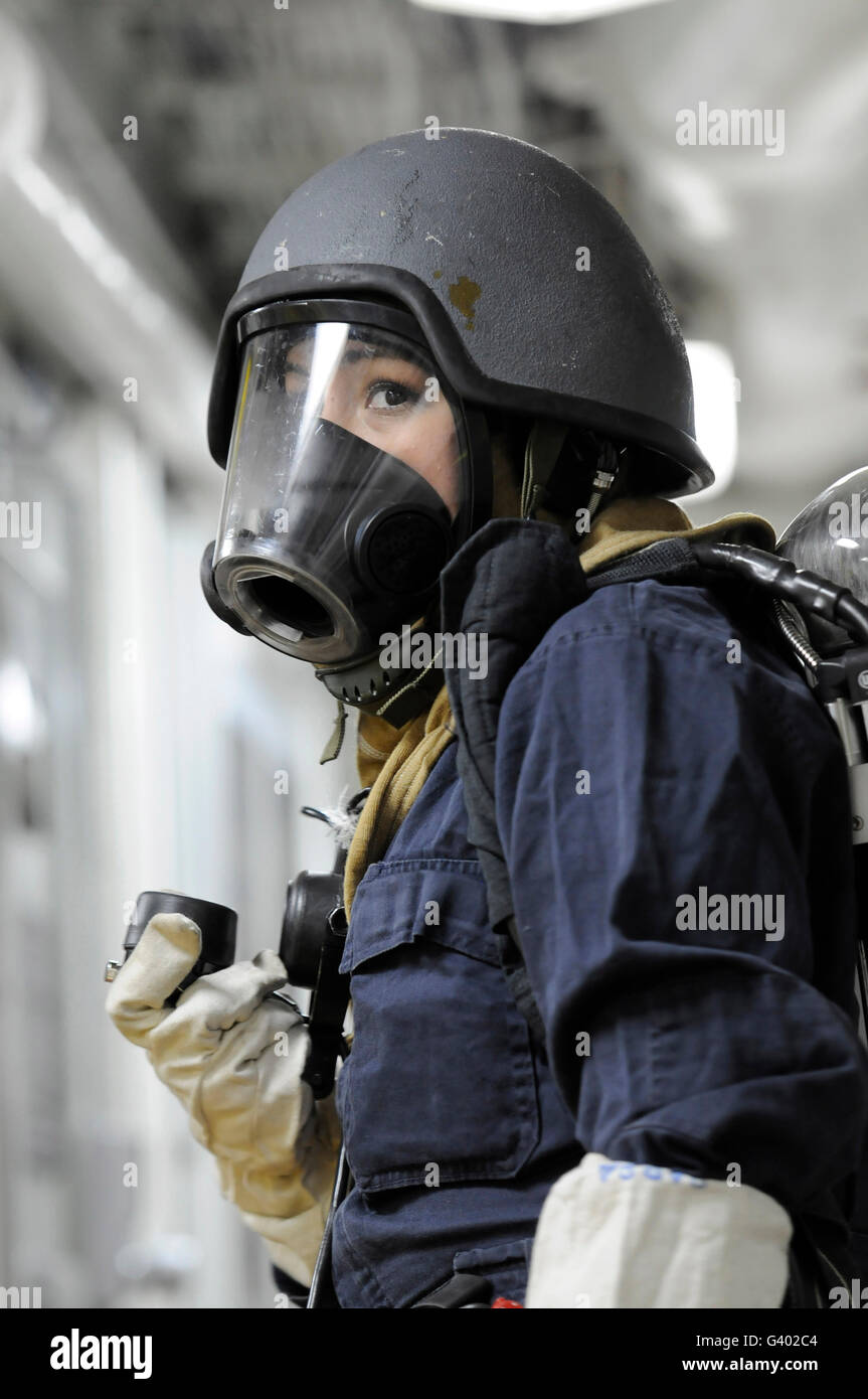 Damage Controlman Fireman in full uniform Stock Photo - Alamy