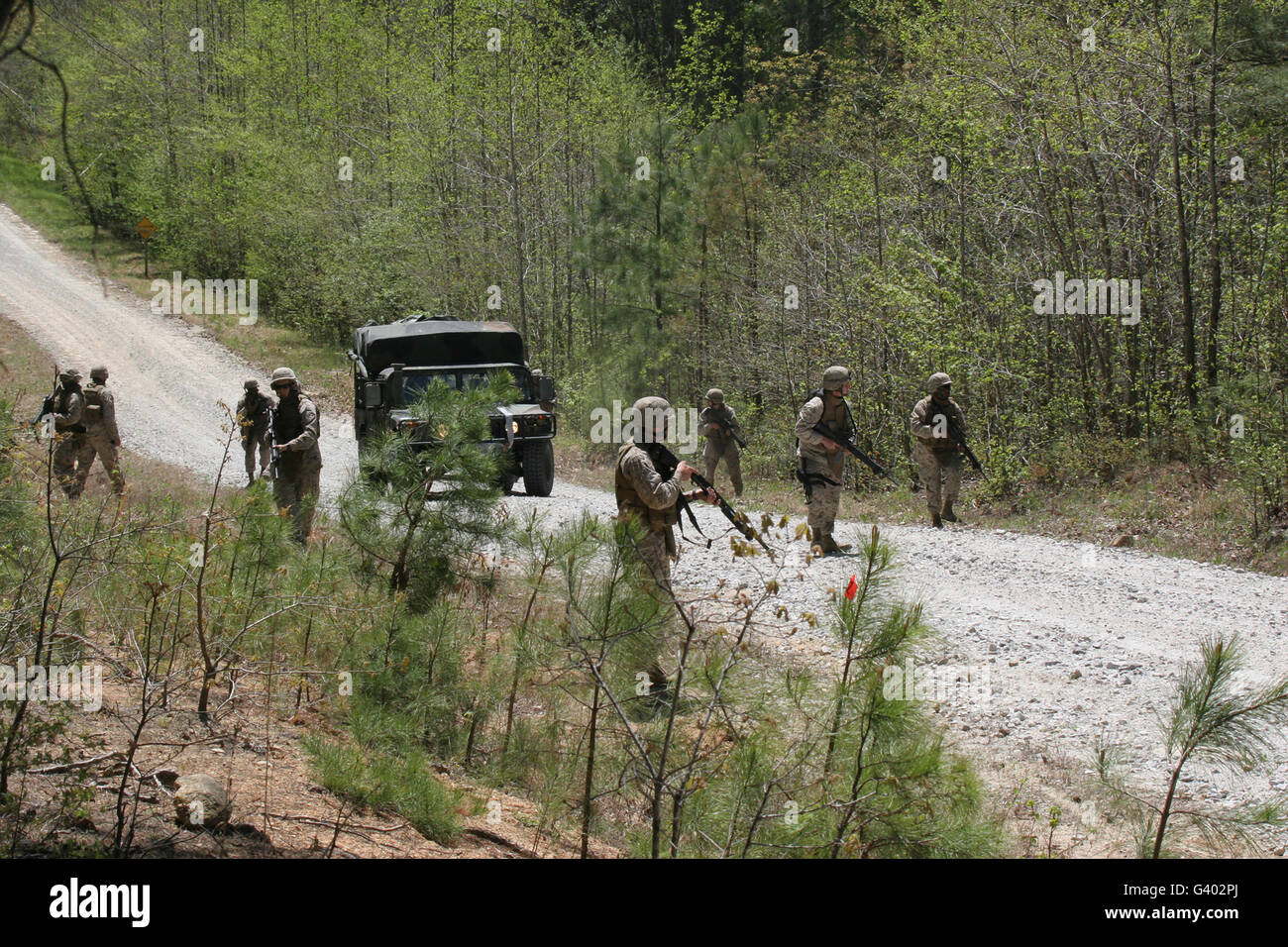 Marines search the vicinity of their vehicle for IED's Stock Photo - Alamy