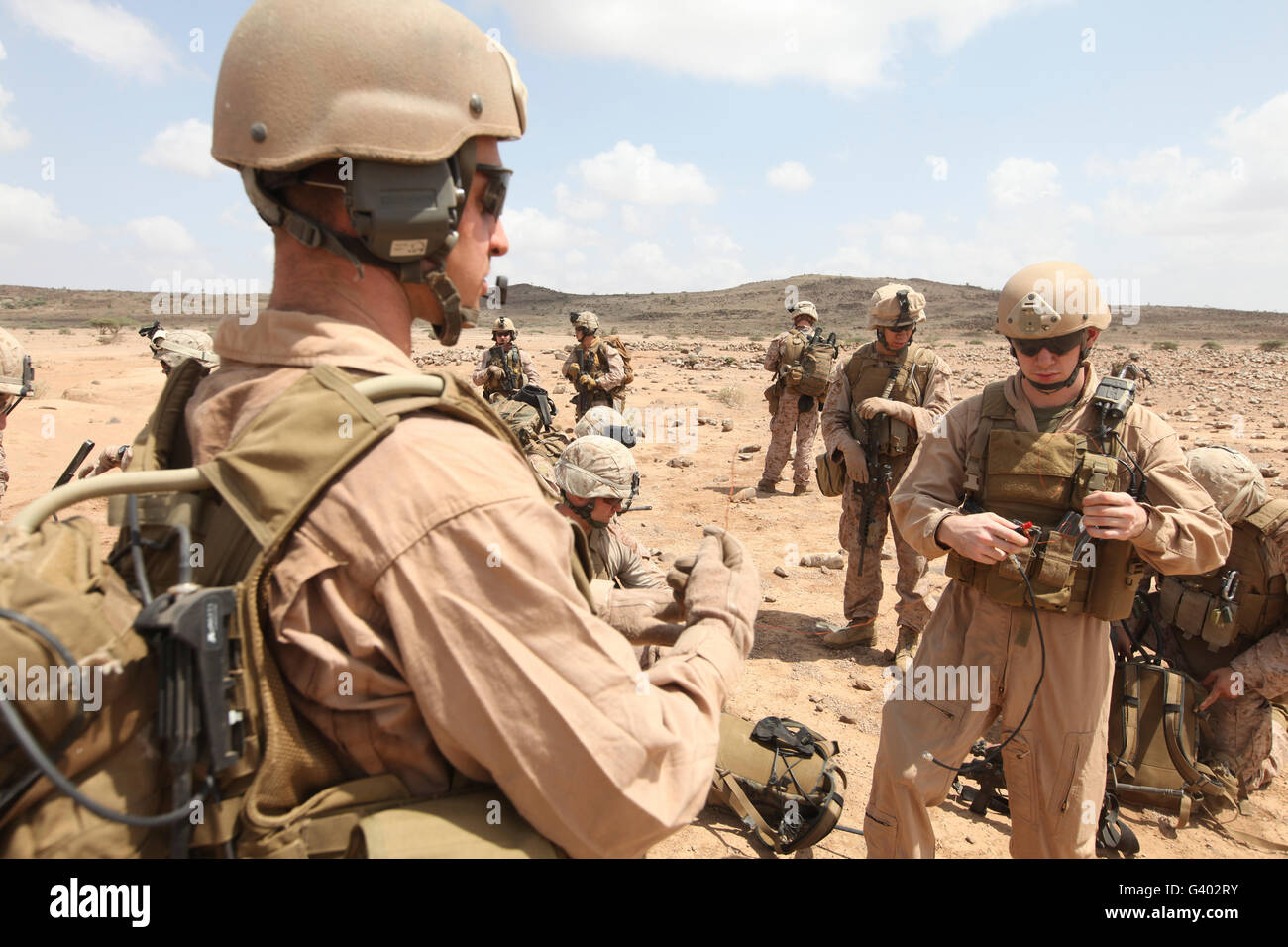 U.S. Marines assemble a field expedient satellite communication antenna ...