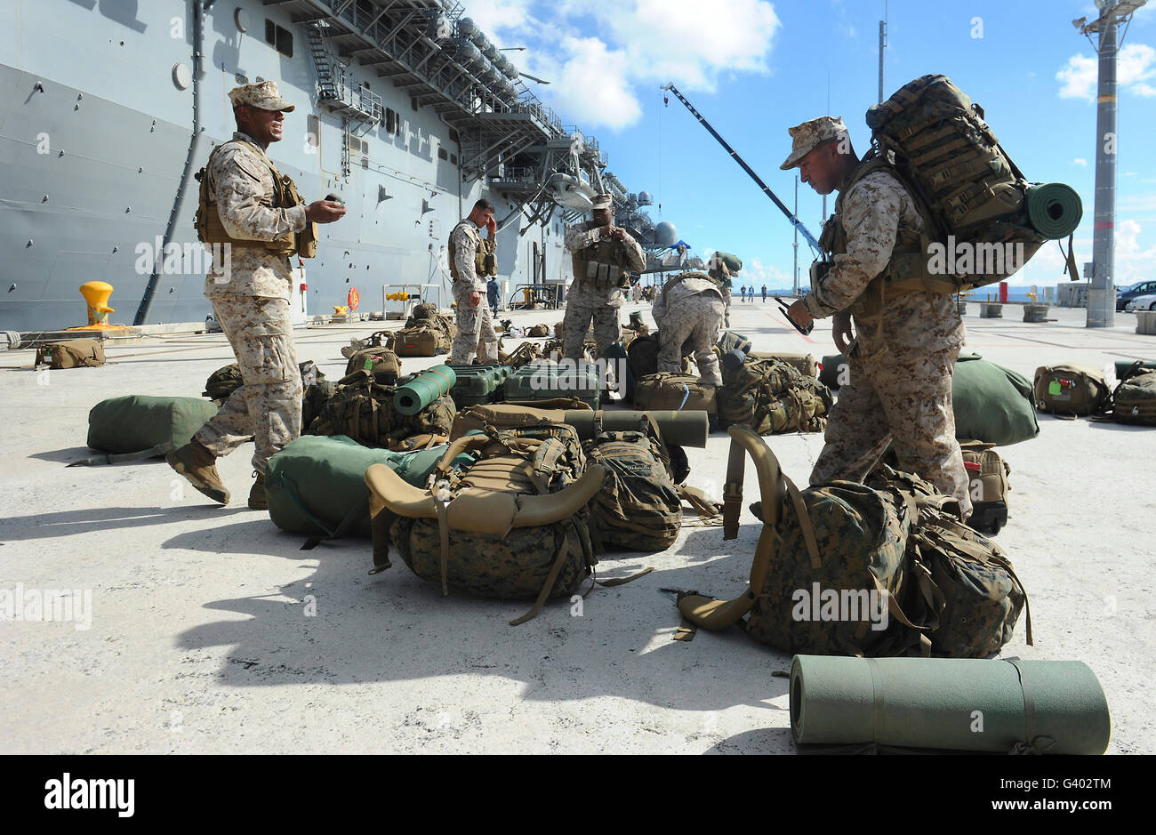 Marines move gear during an embarkation aboard USS Bonhomme Richard ...