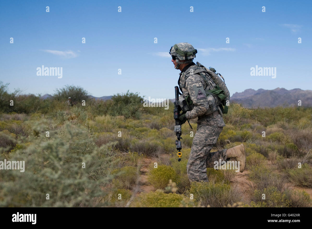 A scout runs back to his base camp after reconnaissance operations ...