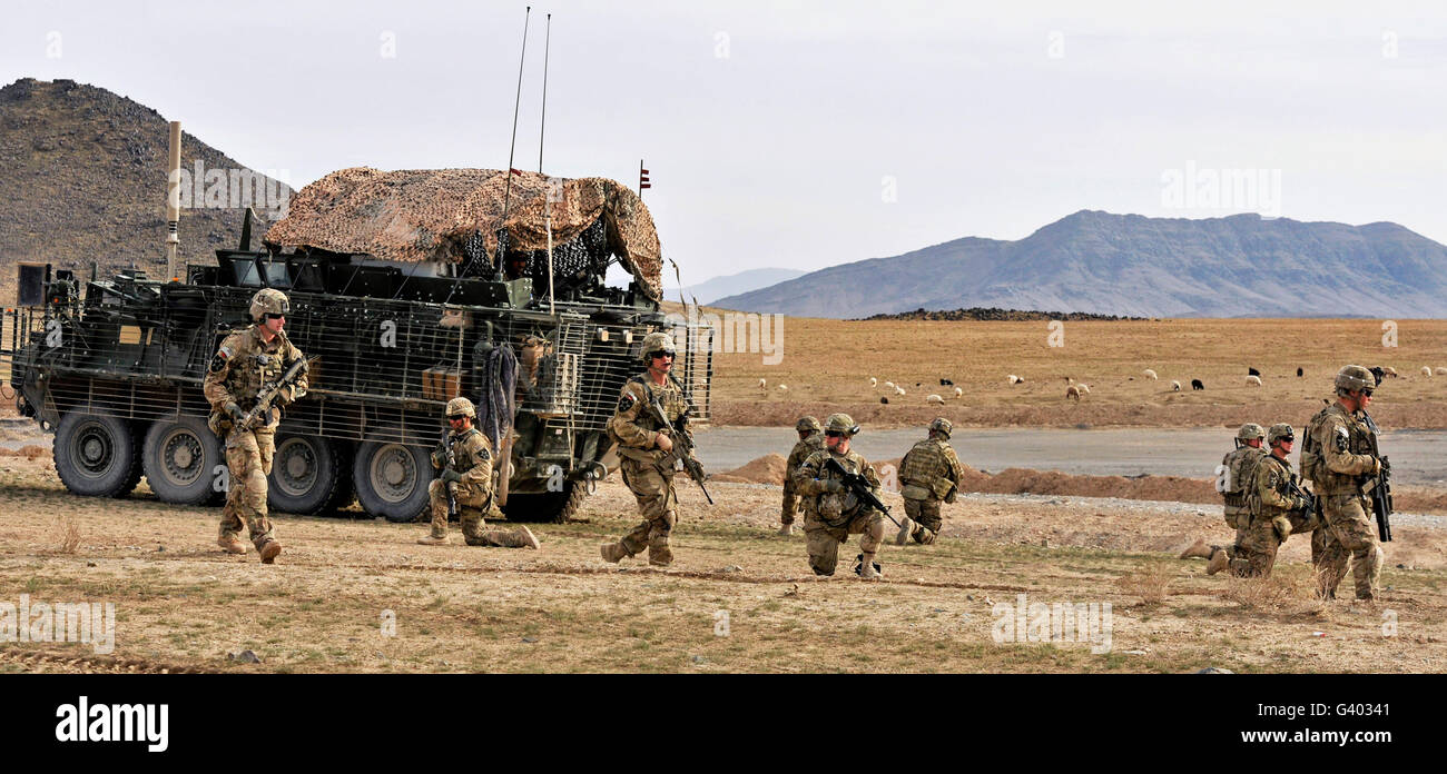 Soldiers secure the area outside an Afghan Uniformed Police checkpoint ...