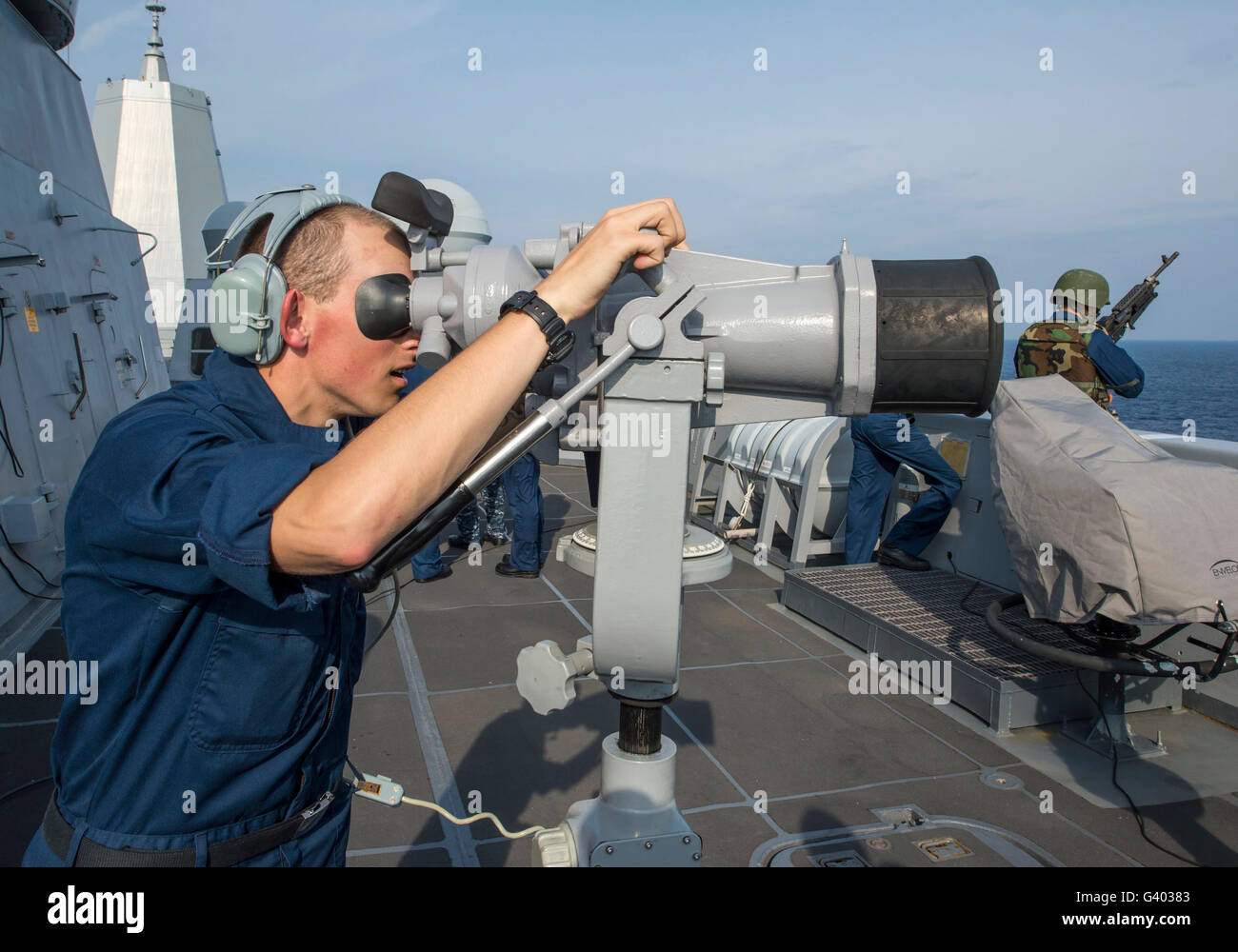 Seaman looks through the Big Eyes aboard USS New Orleans Stock Photo ...