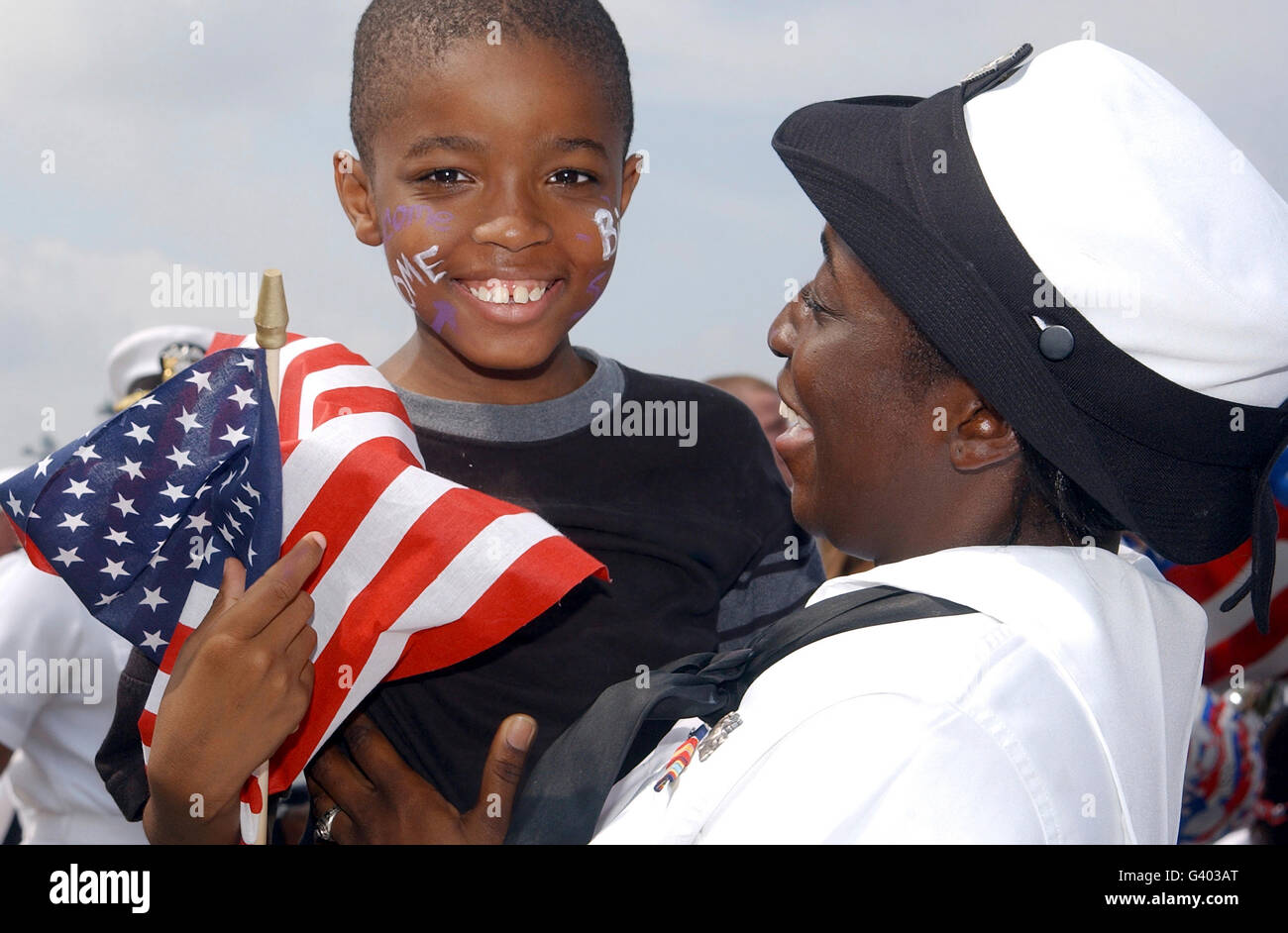A sailor rejoices after being reunited with her family Stock Photo - Alamy