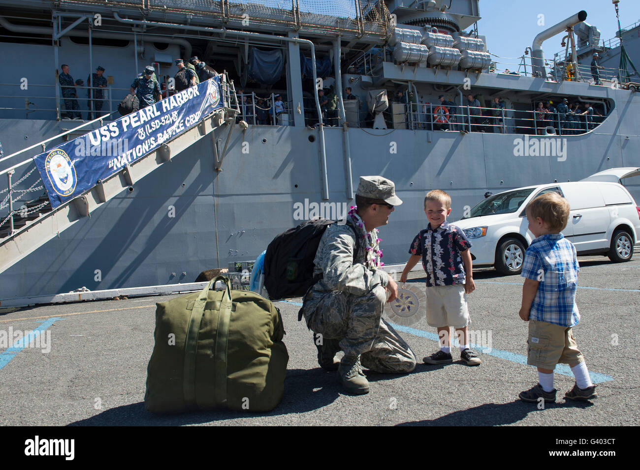 U.S. Air Force Captain greets his family after arriving aboard USS ...