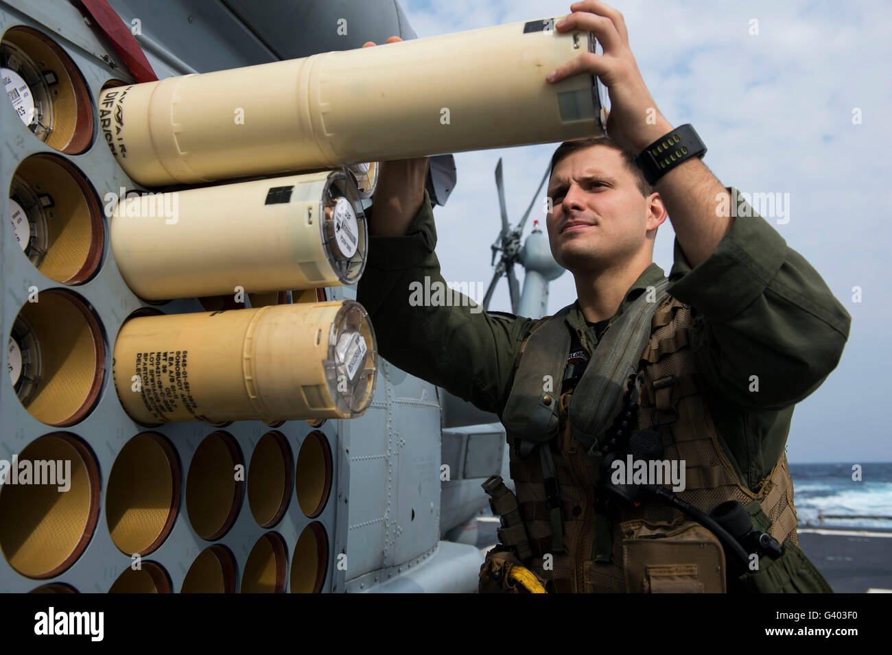 Naval Aircrewman loads sonobuoys on an MH-60R Seahawk Stock Photo - Alamy