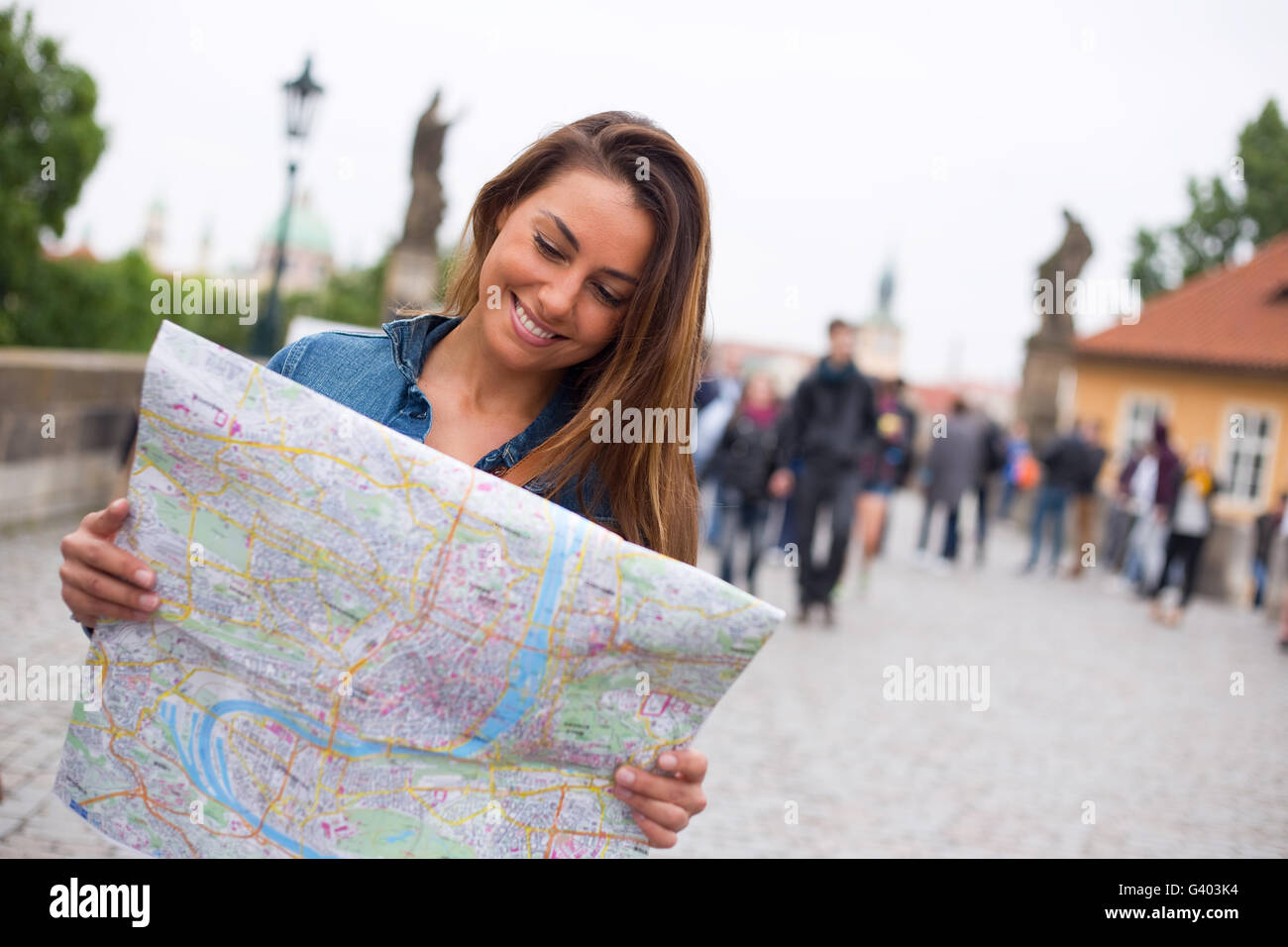 tourist reading a map in prague Stock Photo - Alamy