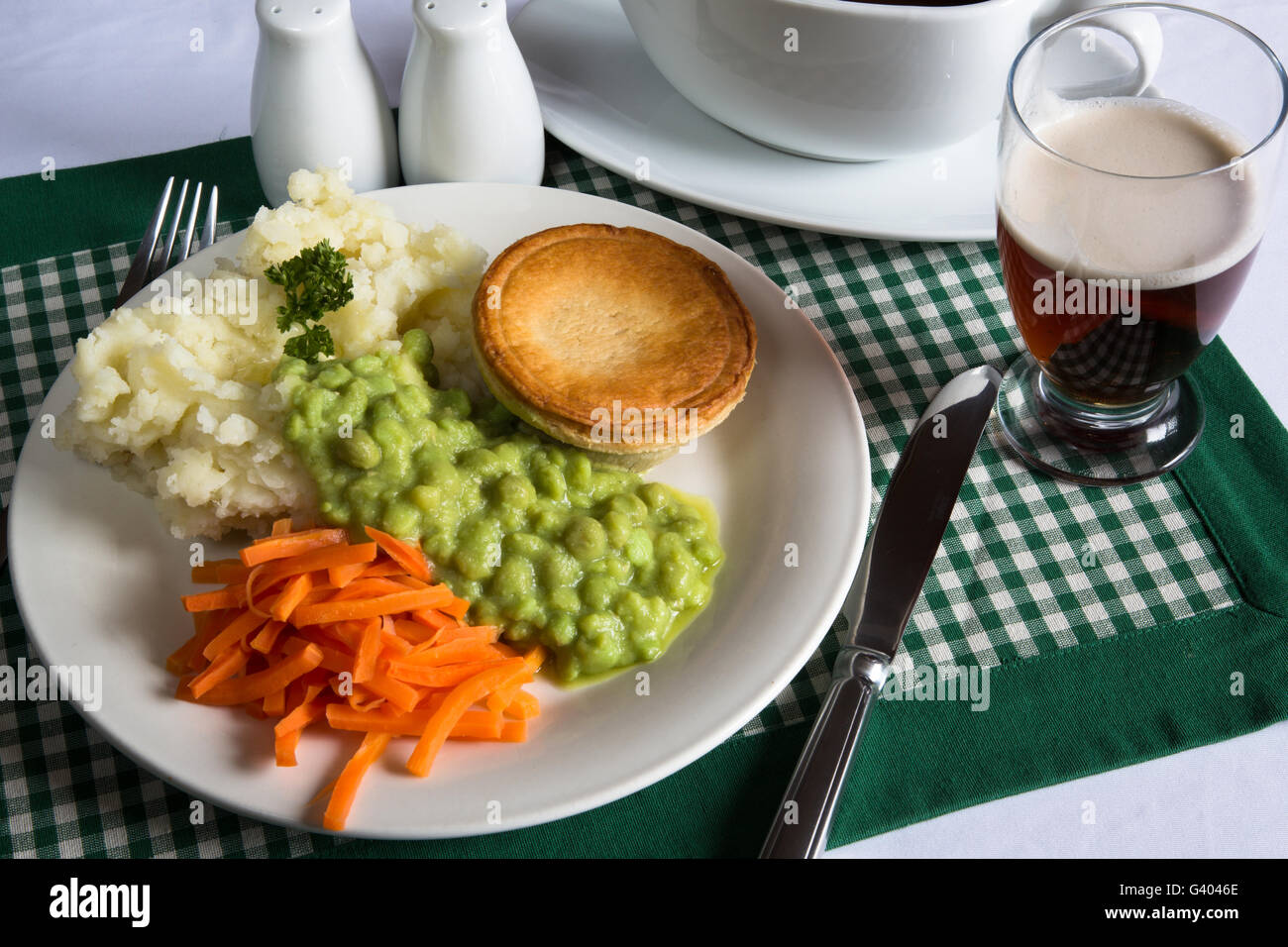 A classic traditional English dish of Steak Pie, Mashed Potato, Mushy ...