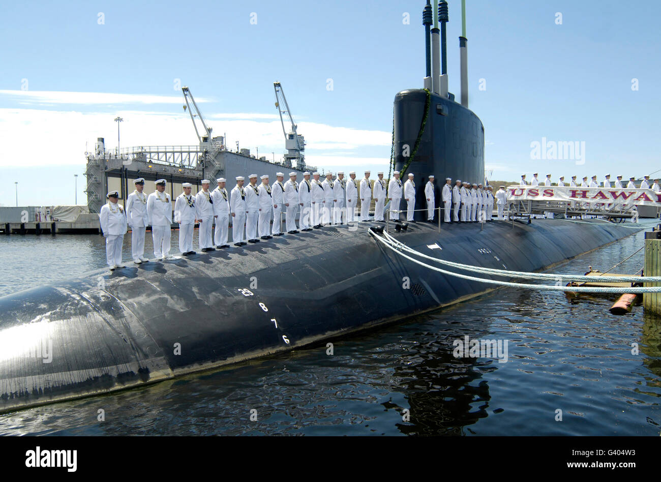 U.S. Navy crew members stand on USS Hawaii during its commissioning ...