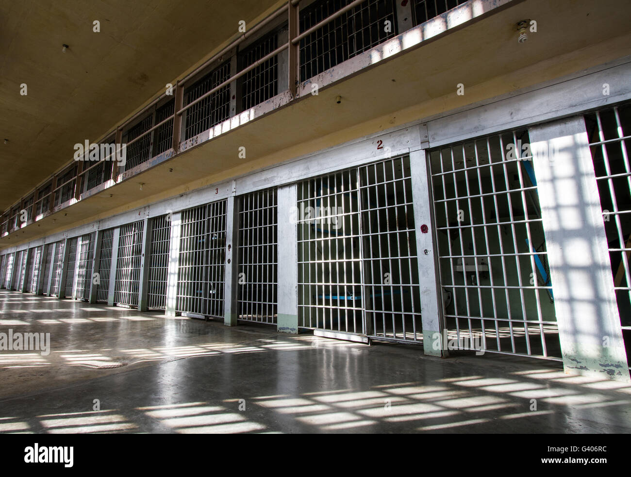 Prison cells all locked up Stock Photo - Alamy