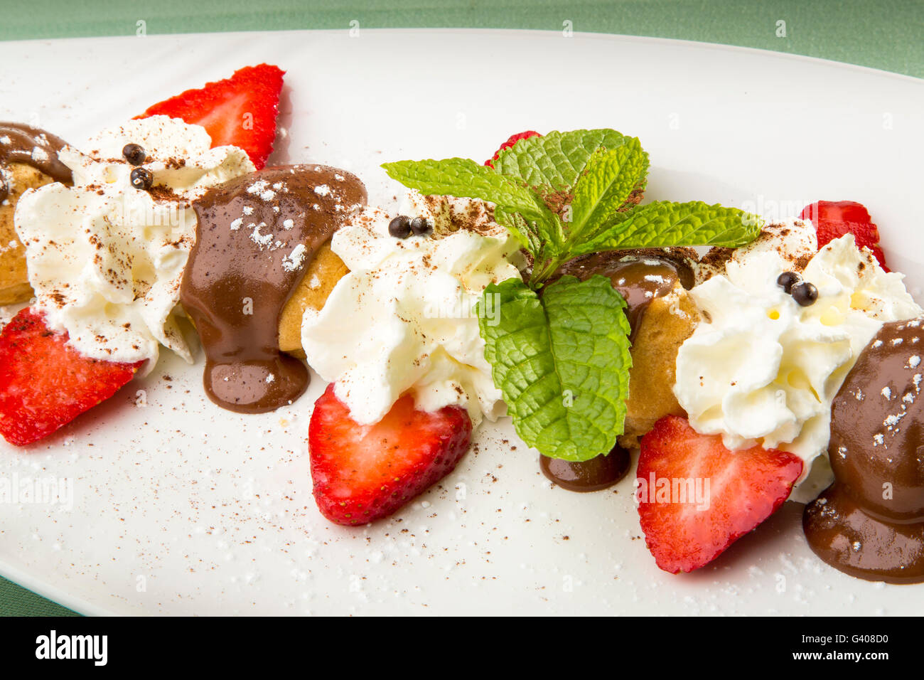 Eating profiteroles hi-res stock photography and images - Alamy