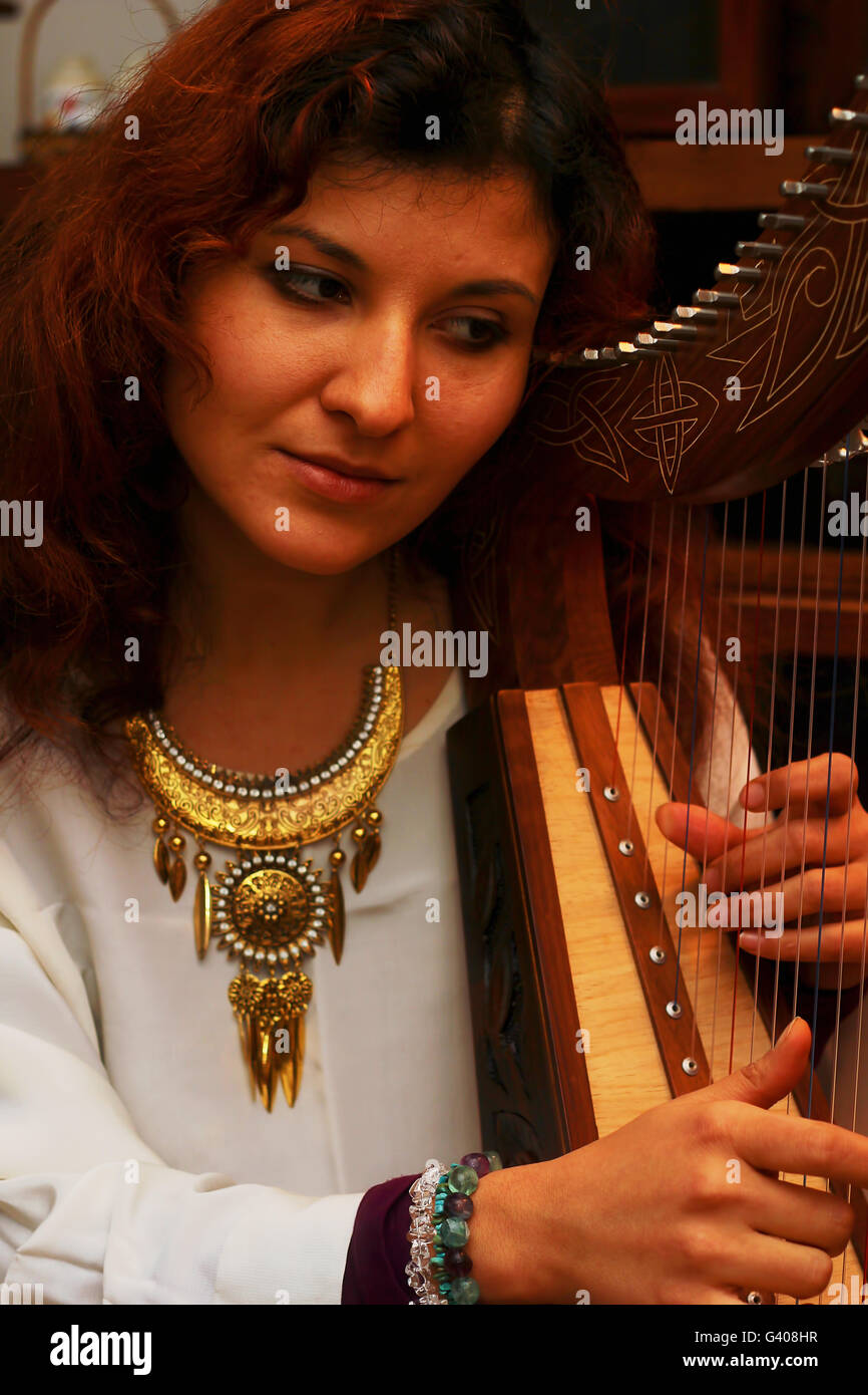 Female woman girl harpist harp playing hi-res stock photography and ...