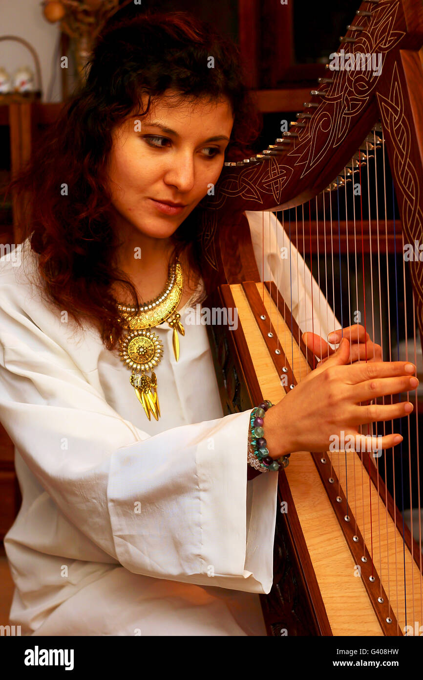 Female woman girl harpist harp playing hi-res stock photography and ...