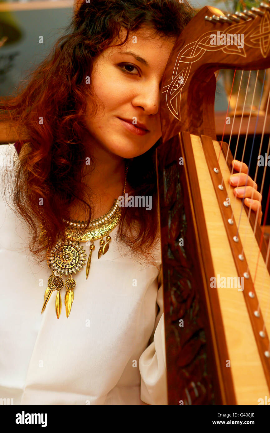 Female woman girl harpist harp playing hi-res stock photography and ...