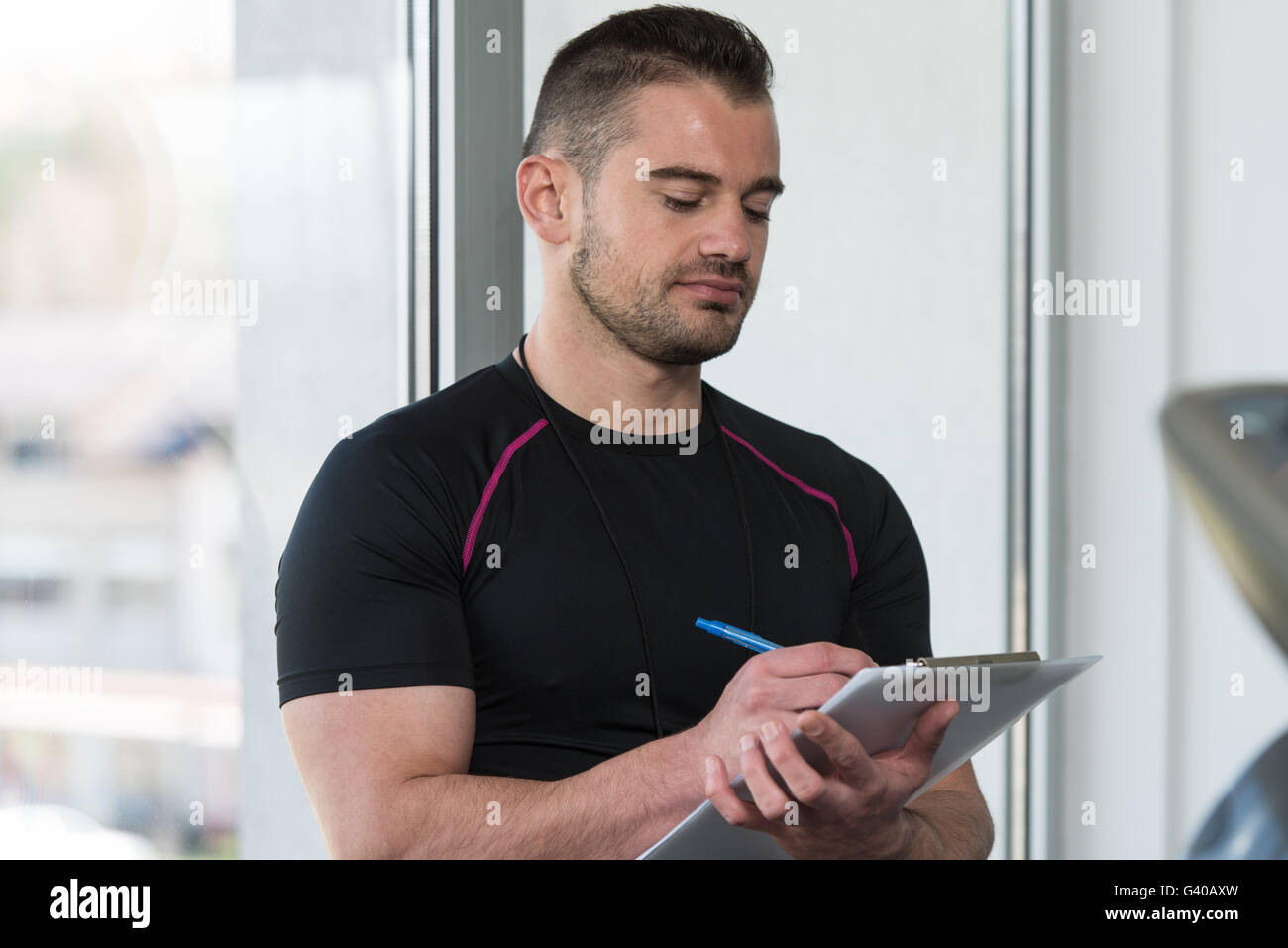 Group Of People Exercising On Elliptical Walker In Gym Or Fitness Club ...
