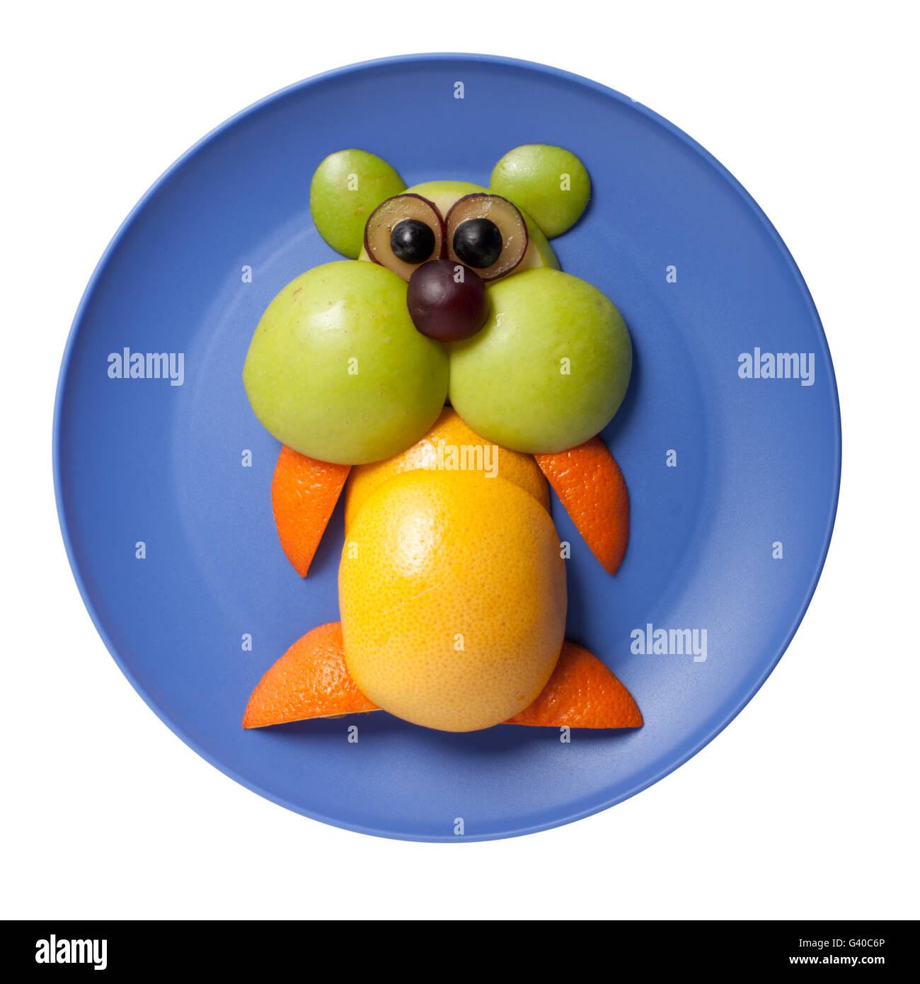 Hamster made of fruits on blue plate Stock Photo - Alamy