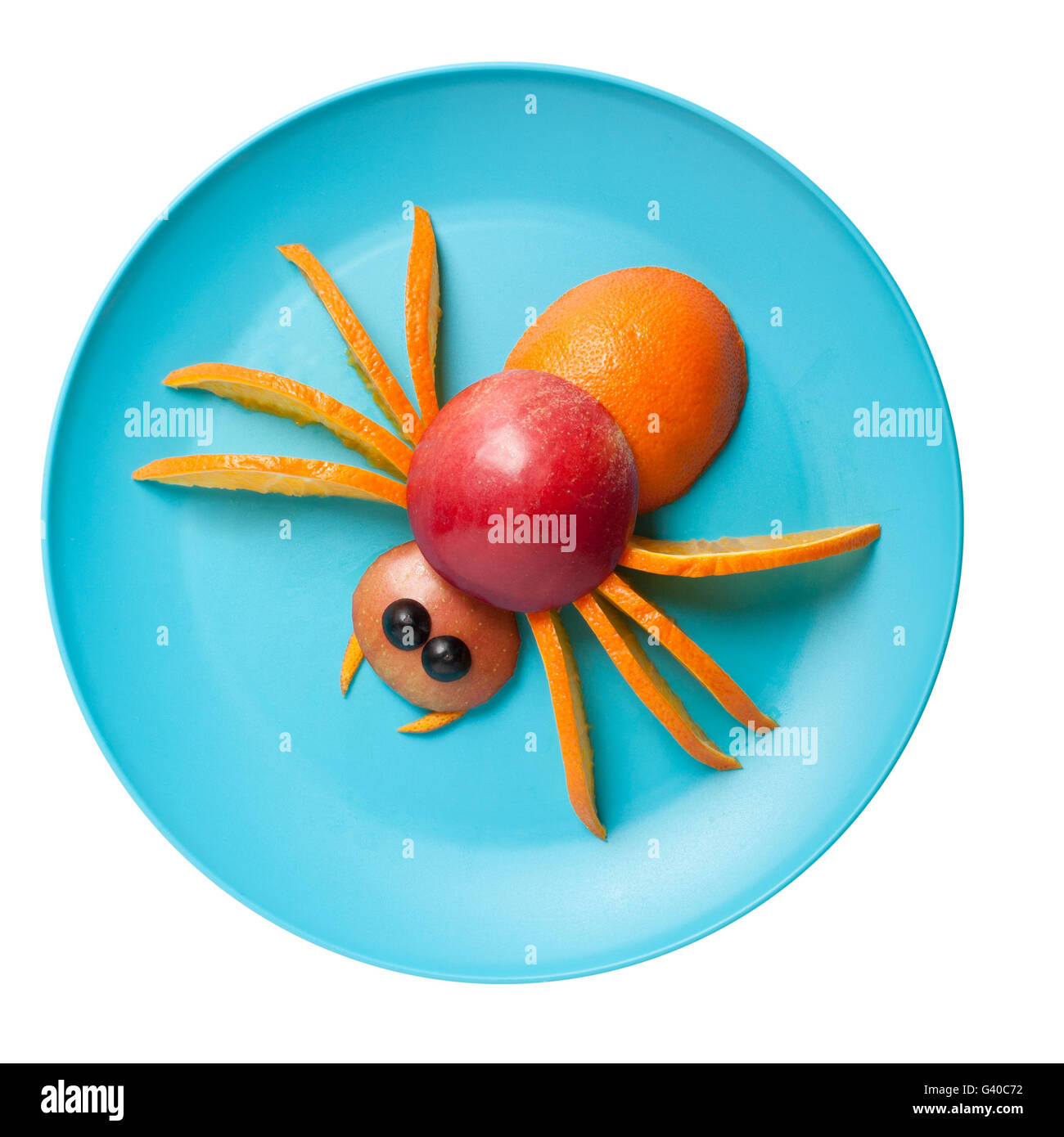 Spider made of fruits on blue plate Stock Photo - Alamy