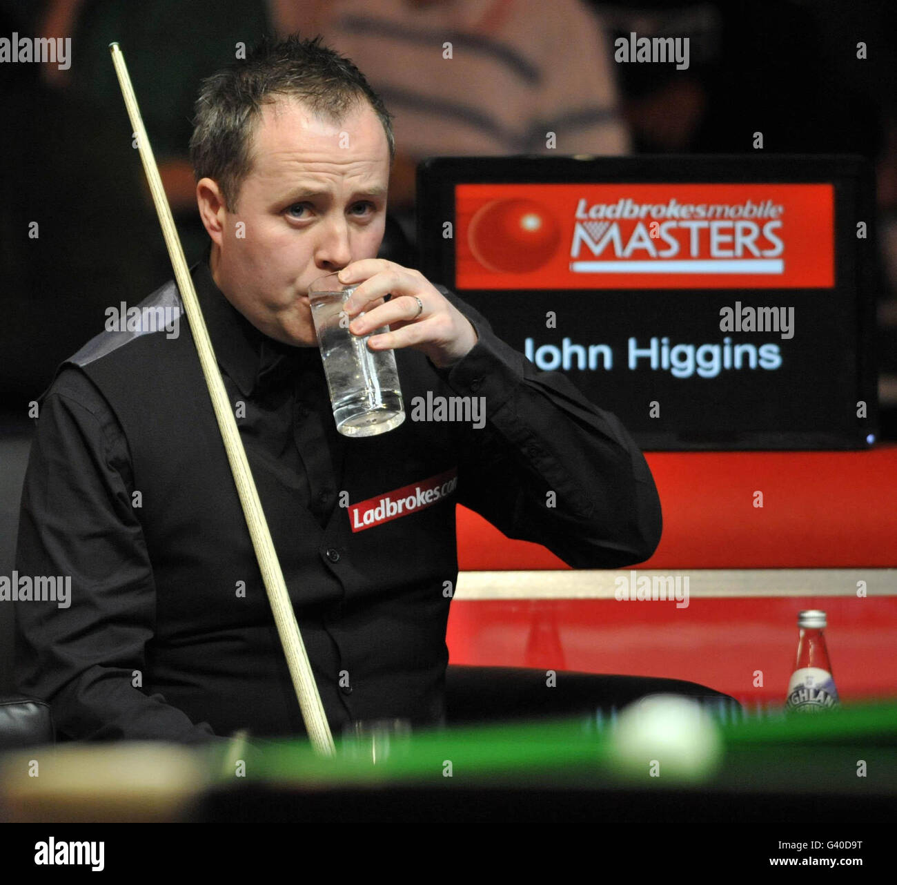 John Higgins takes a drink during his match against Graeme Dott during ...