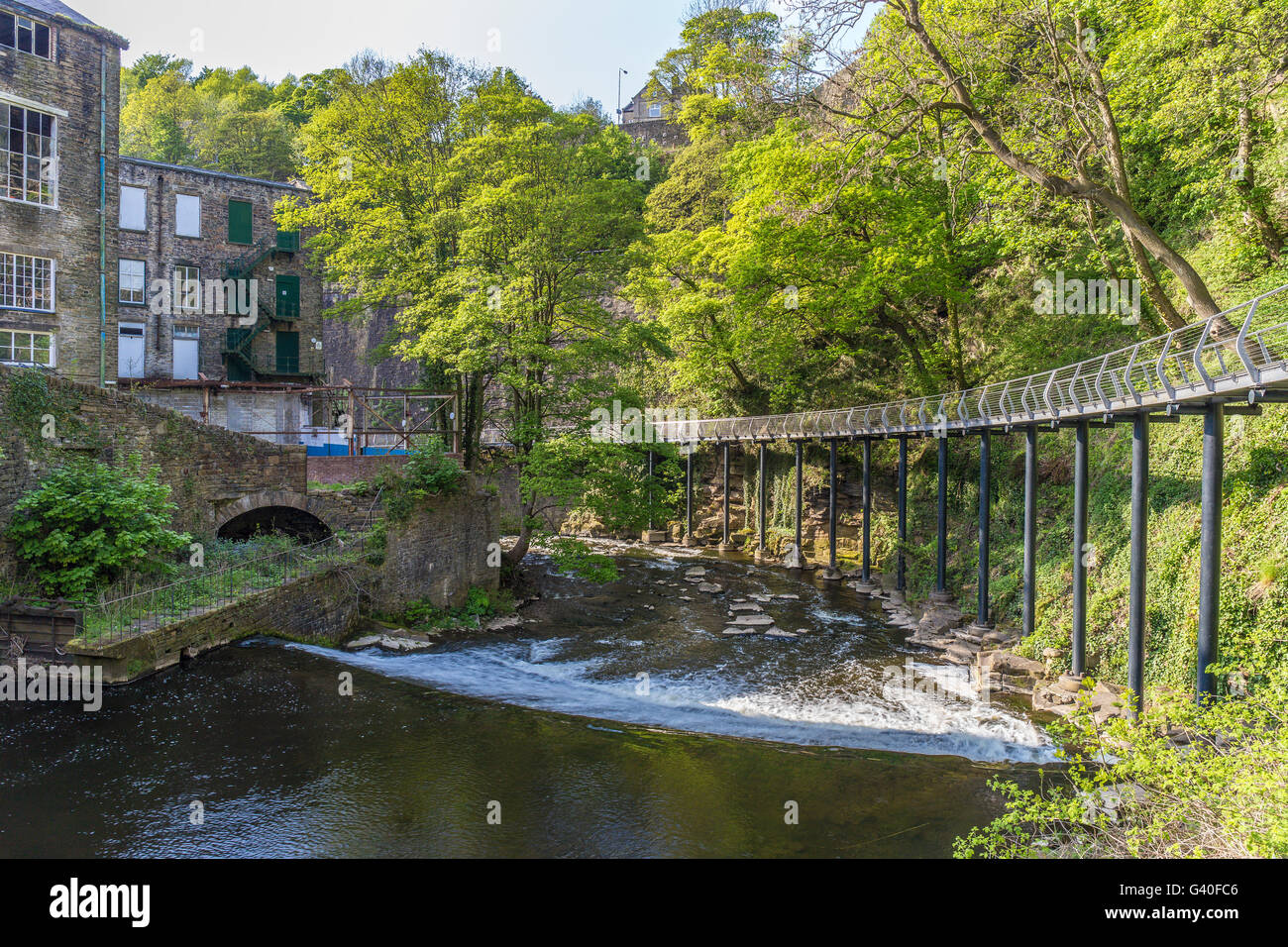 Millennium Bridge and Weir on the River Goyt at New Mills Stock Photo ...