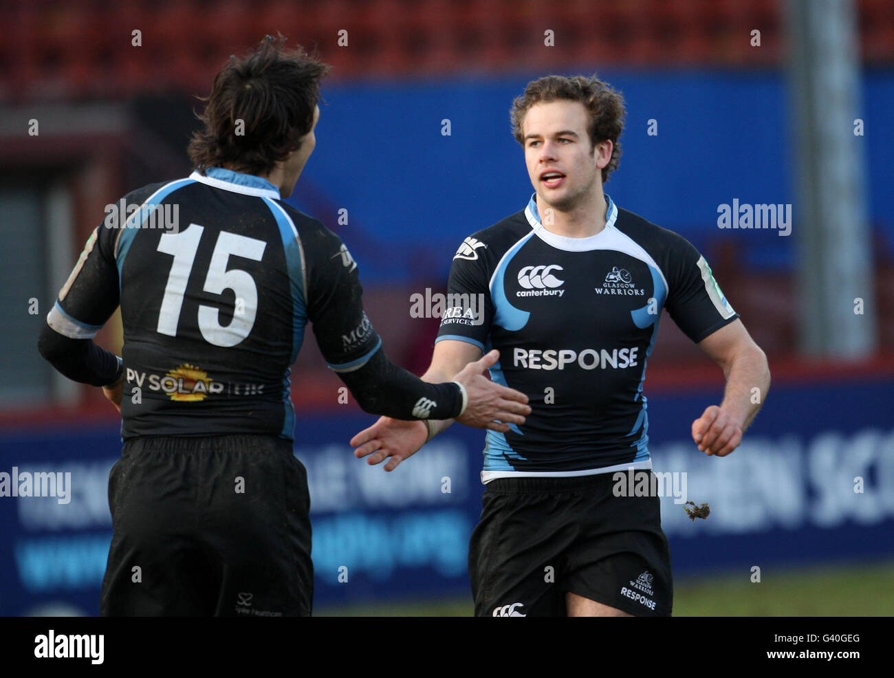 Glasgow's Ruaridh Jackson (right) celebrates a drop goal with Bernardo ...