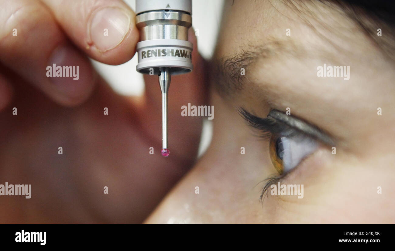 Laboratory technician Lisa Muir holds a Coordinate Measuring Machine at ...