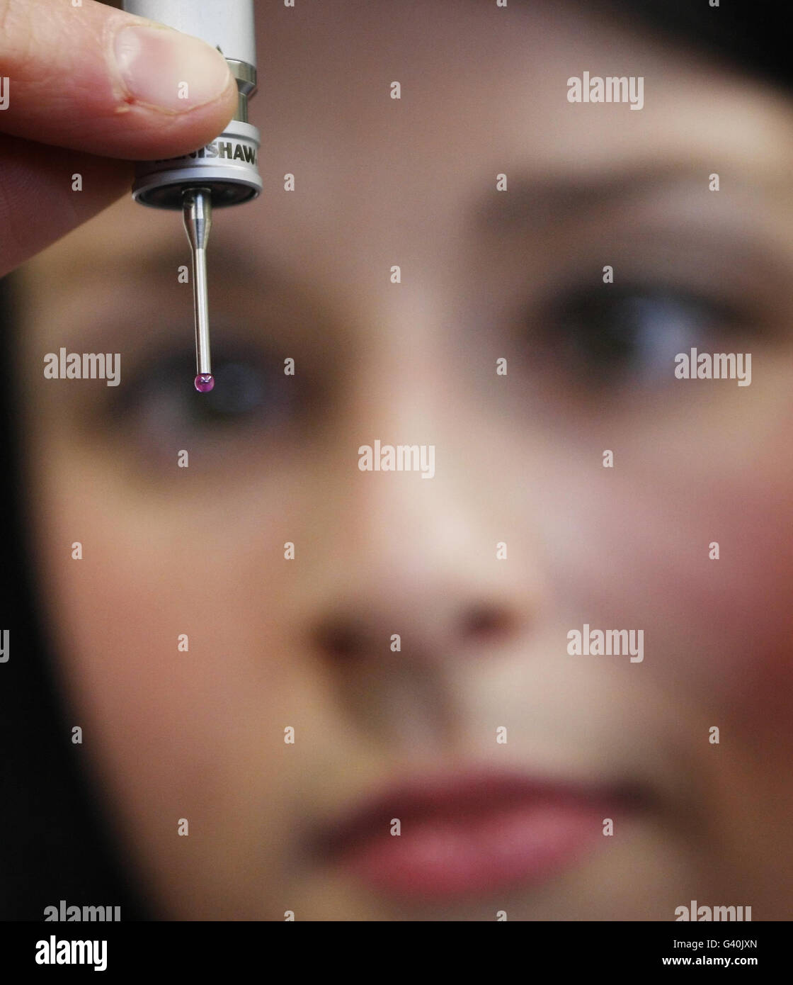 Laboratory technician Lisa Muir holds a Coordinate Measuring Machine at ...