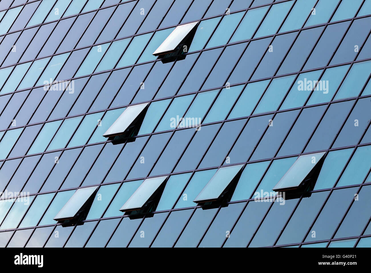 glass facade with opened windows on a modern building Stock Photo - Alamy
