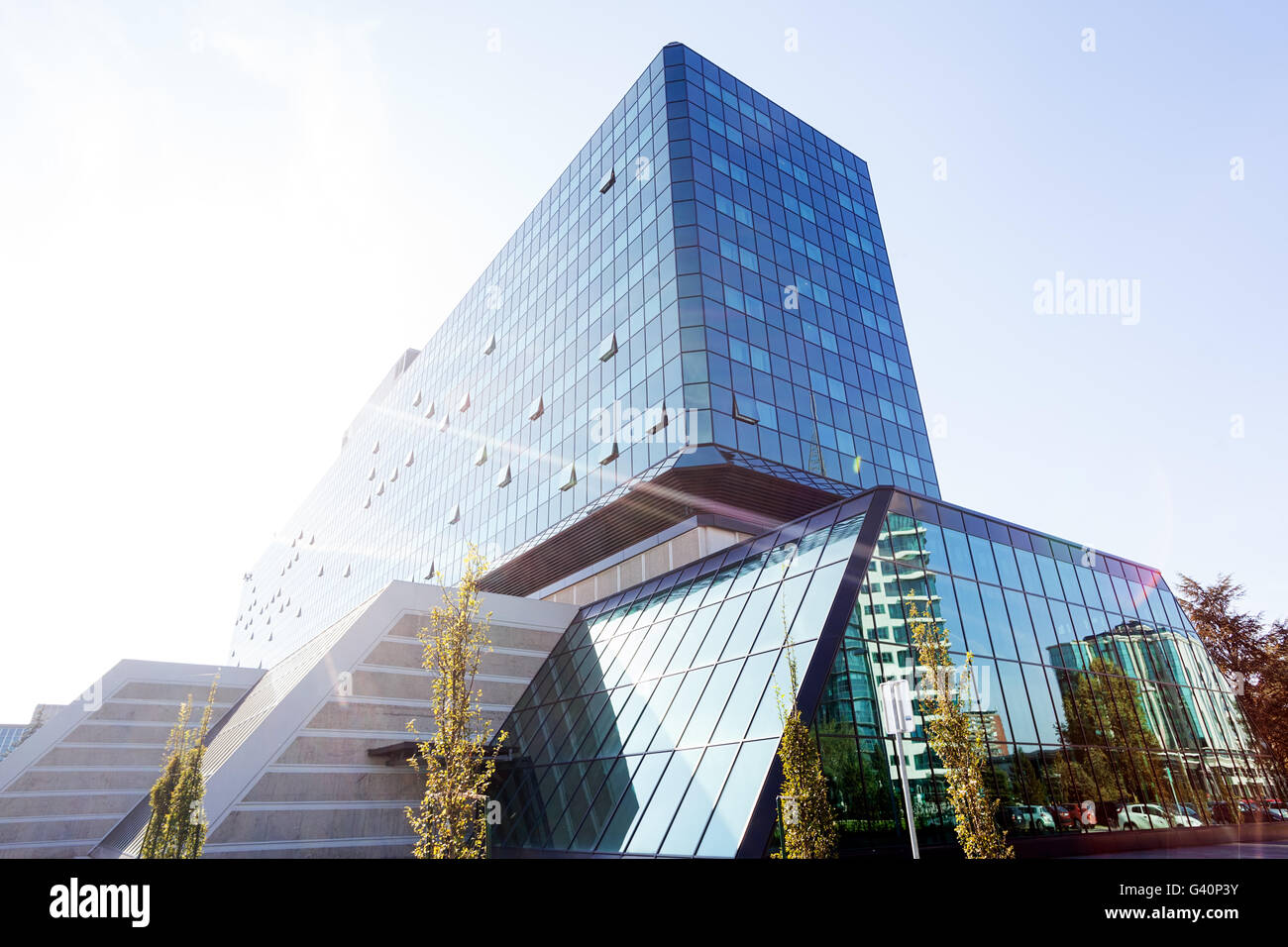 Reflections on modern building's blue and green glass facade Stock ...