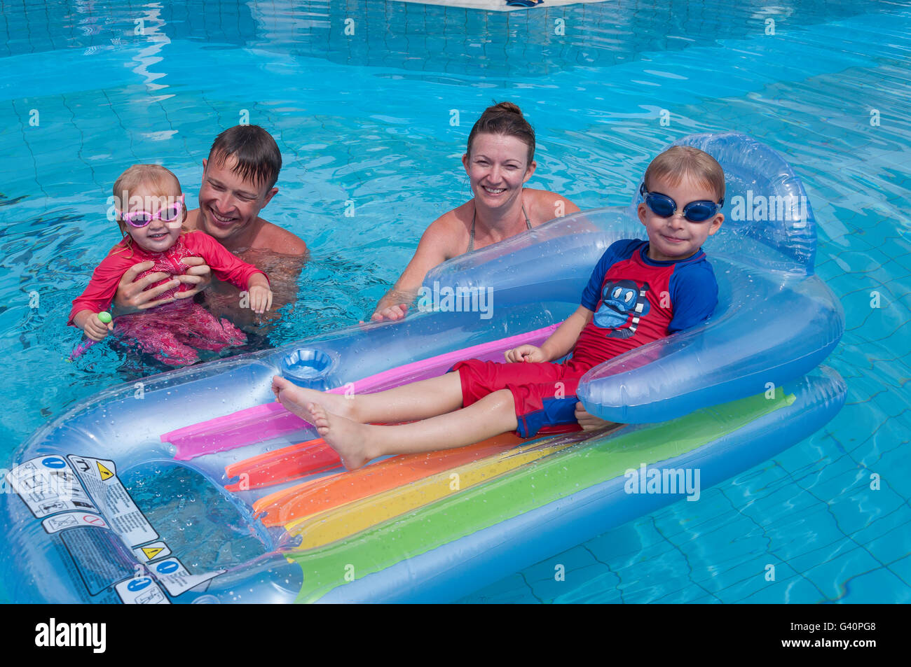 Family at beach lilo hi-res stock photography and images - Alamy