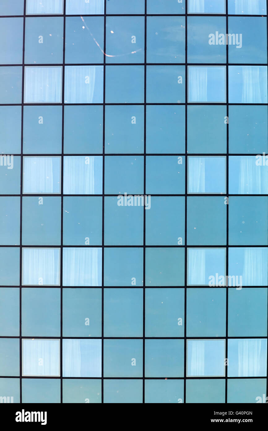 Modern office skyscraper with blue and green glass facade Stock Photo ...