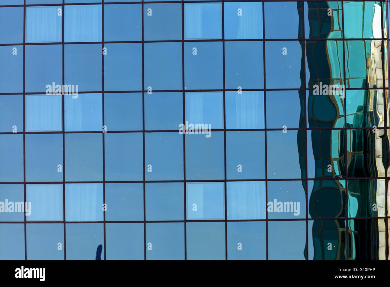Modern office skyscraper with blue and green glass facade Stock Photo ...