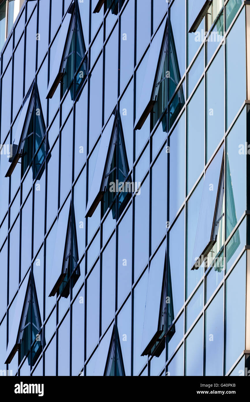 glass facade with opened windows on a modern building Stock Photo - Alamy