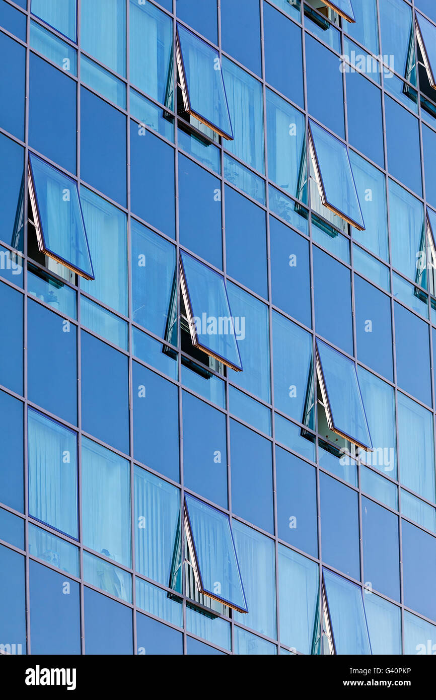 glass facade with opened windows on a modern building Stock Photo - Alamy