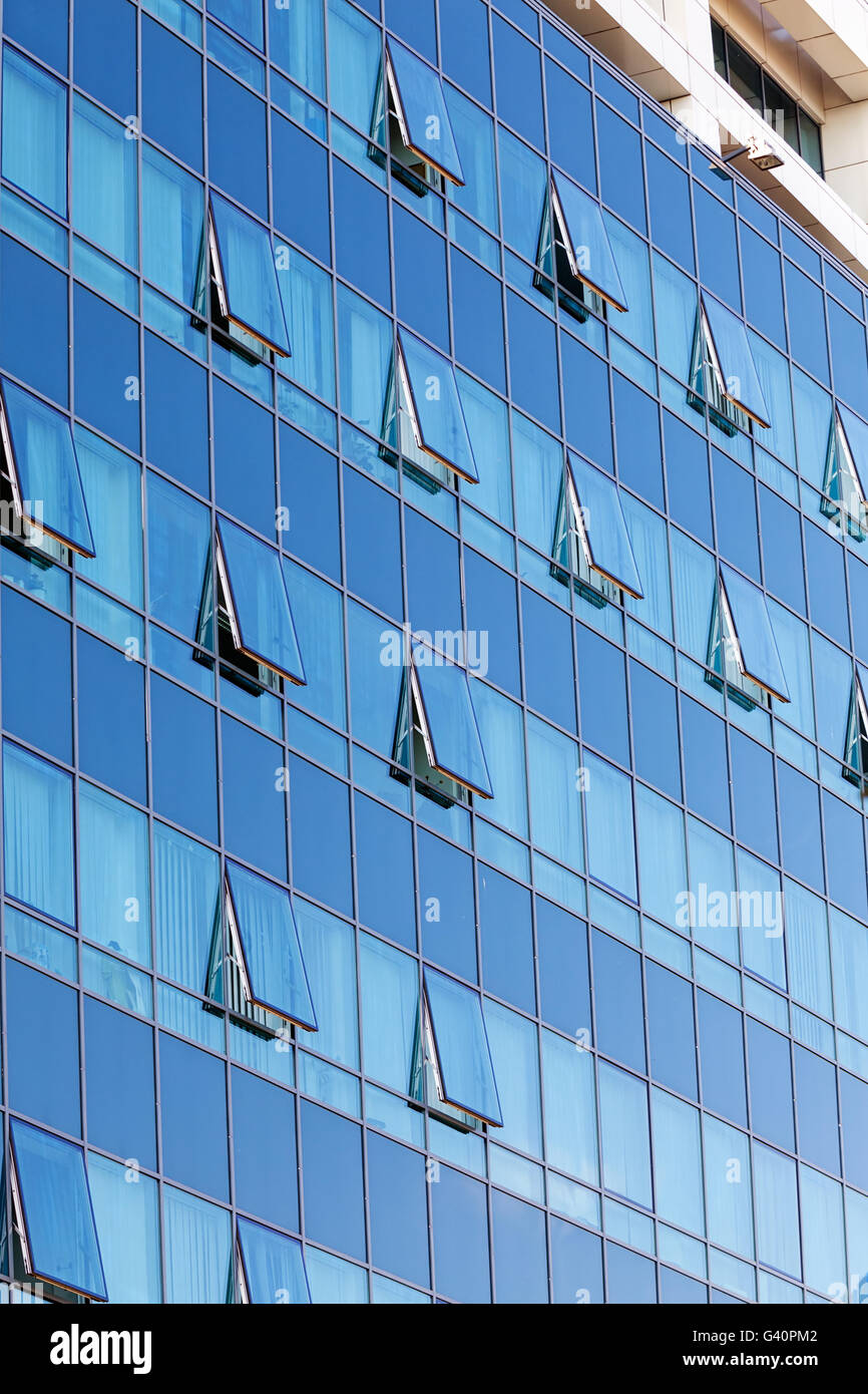 glass facade with opened windows on a modern building Stock Photo - Alamy
