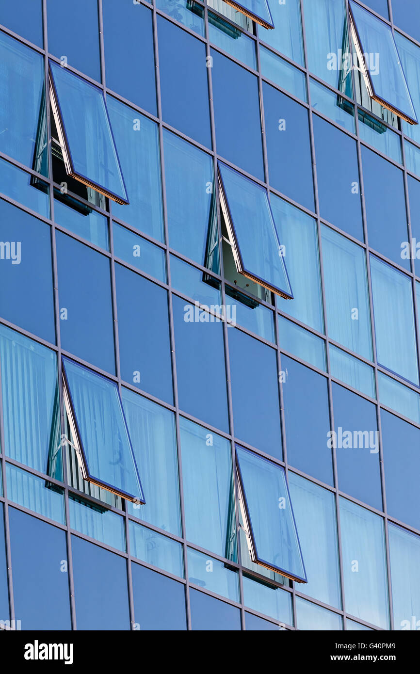 glass facade with opened windows on a modern building Stock Photo - Alamy