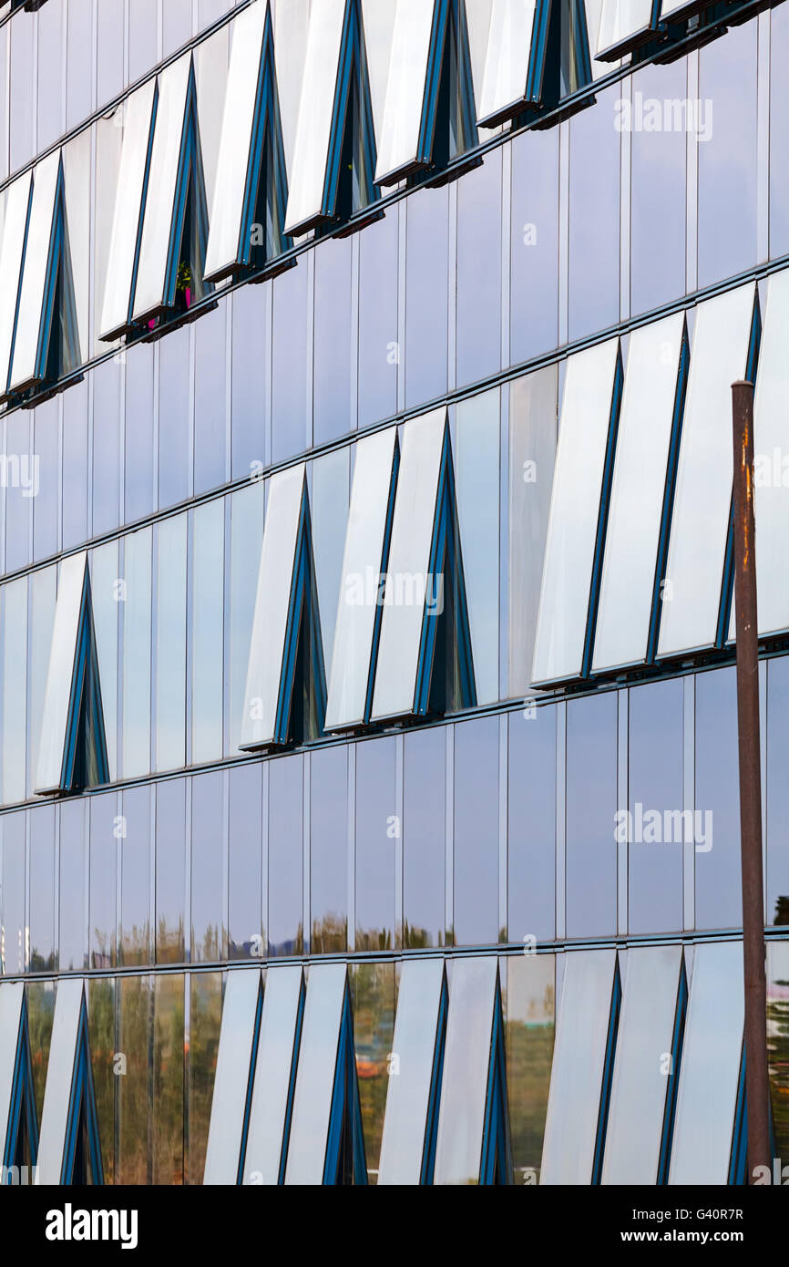 glass facade with opened windows on a modern building Stock Photo - Alamy