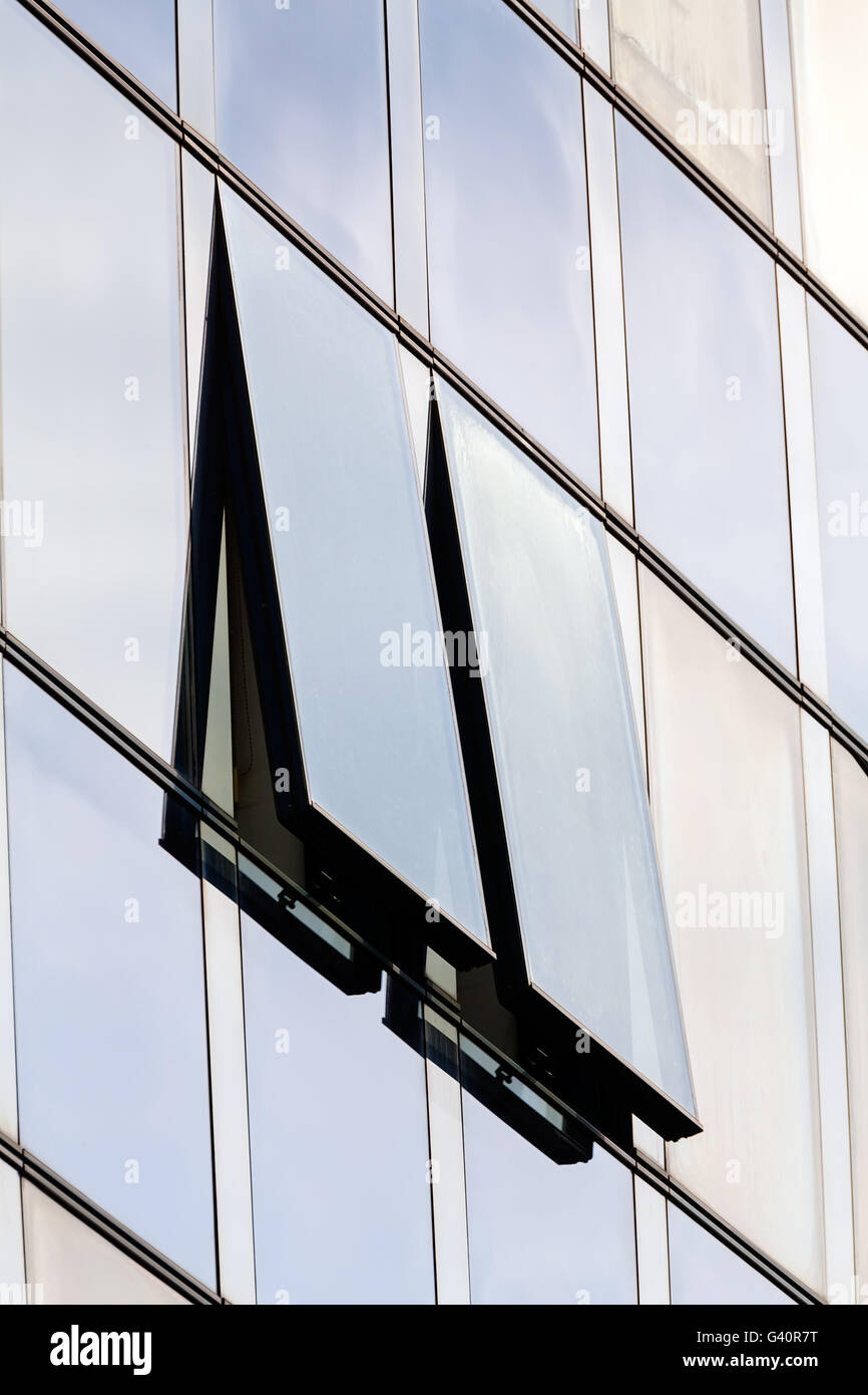 glass facade with opened windows on a modern building Stock Photo - Alamy