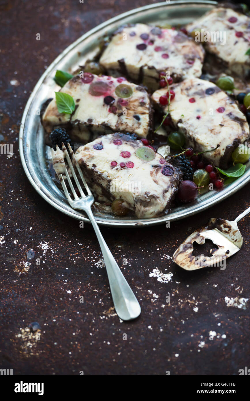 Semifreddo or italian cheese ice-cream dessert with garden berries and ...