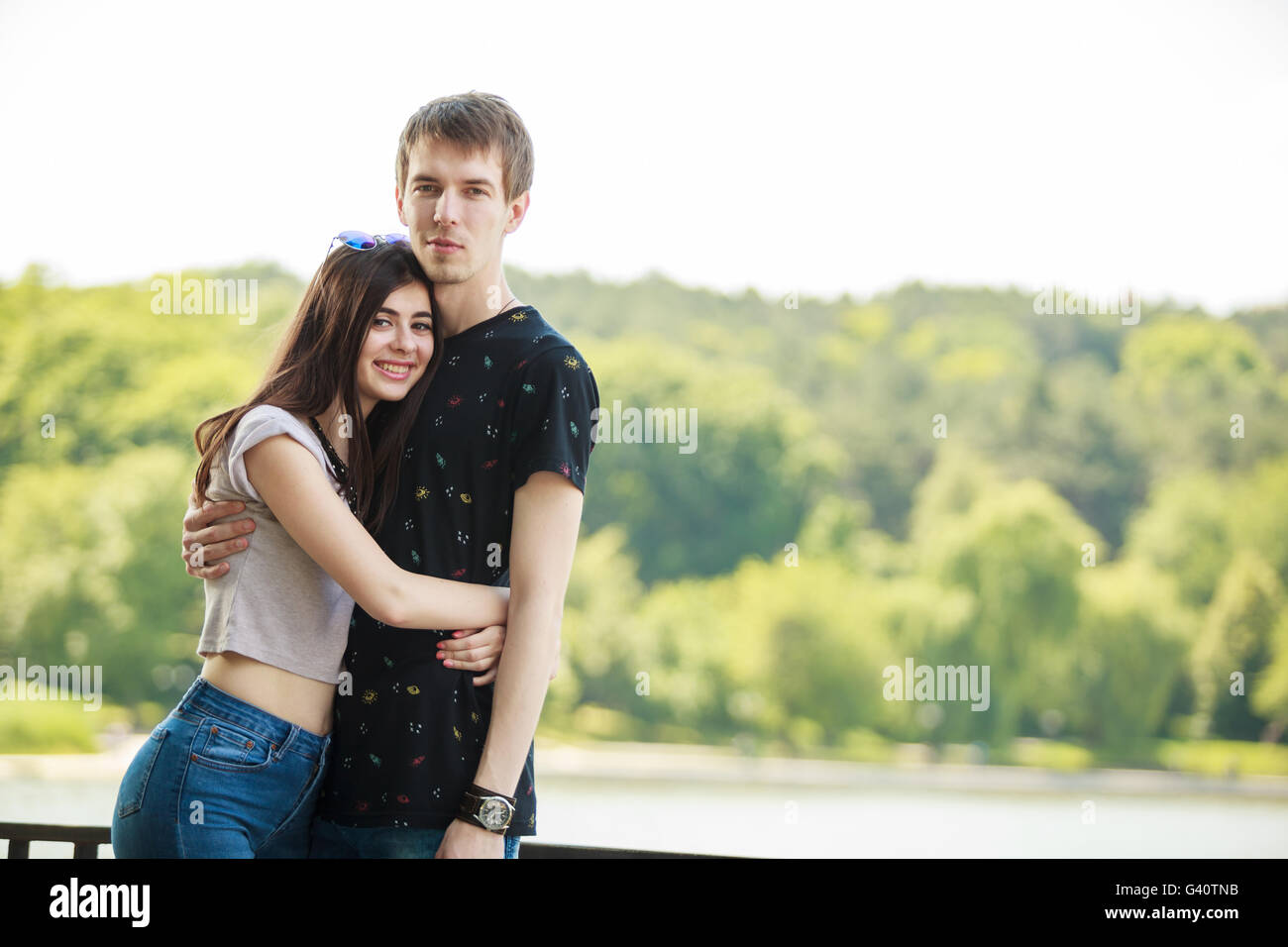 Happy couple in the park in romatic day Stock Photo - Alamy