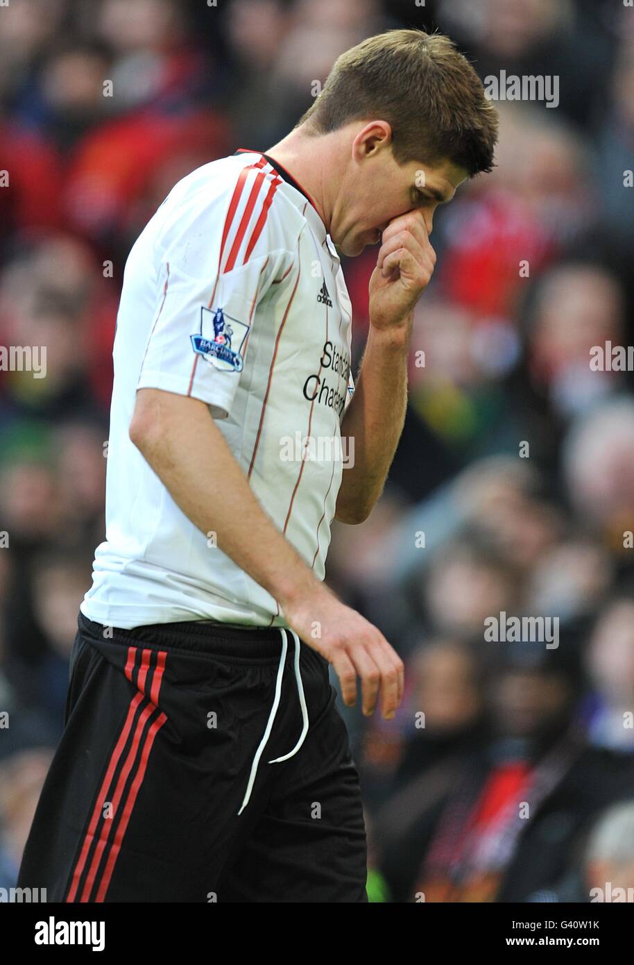 Liverpool's Steven Gerrard walks off the pitch dejected after being ...