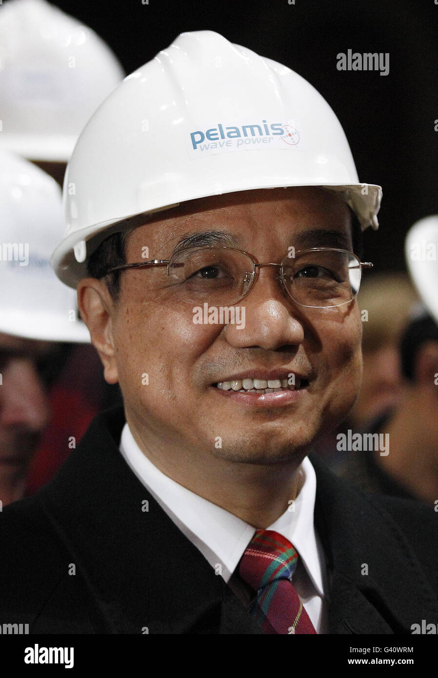 China's Vice Premier Li Keqiang (centre) smiles during a tour of the ...