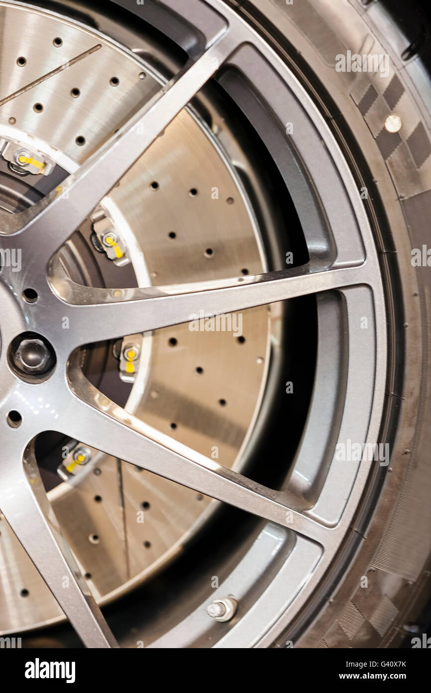 Modern steel car wheel with new tyre Stock Photo - Alamy