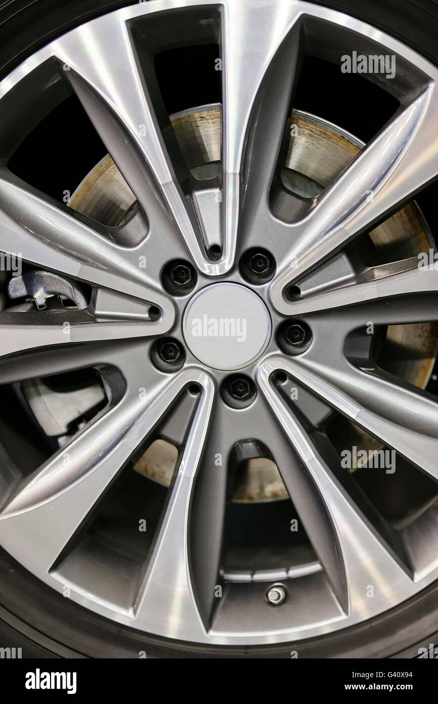 Modern steel car wheel with new tyre Stock Photo - Alamy