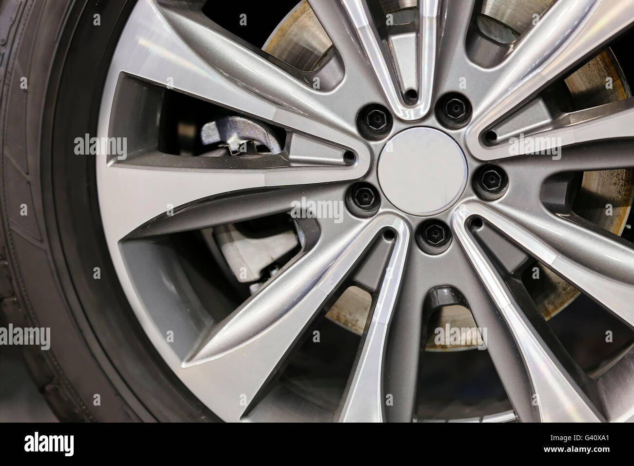 Modern steel car wheel with new tyre Stock Photo - Alamy