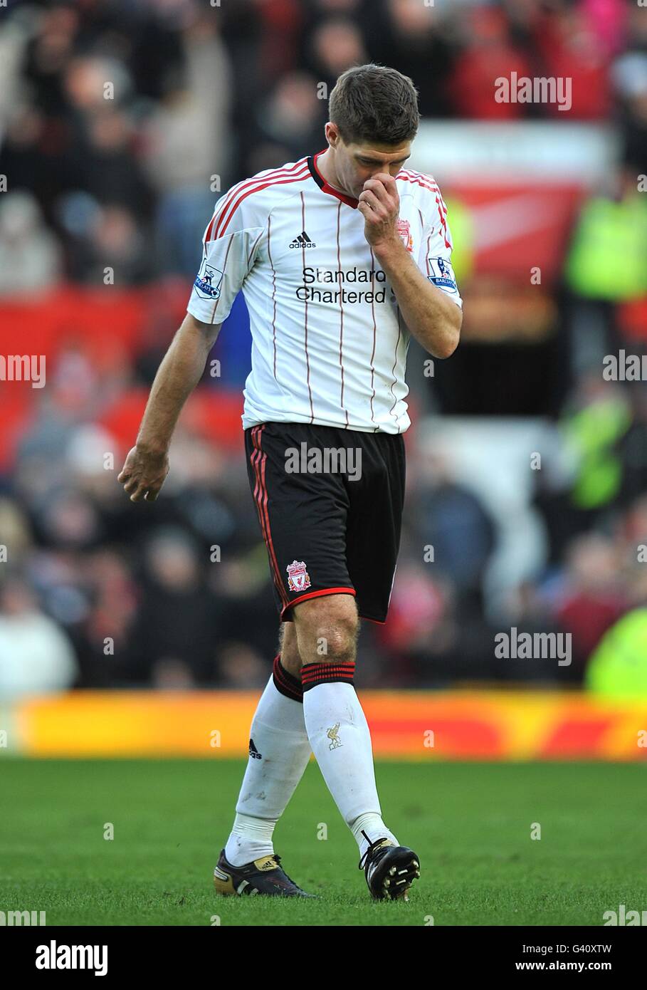 Liverpool's Steven Gerrard walks off the pitch dejected after being ...