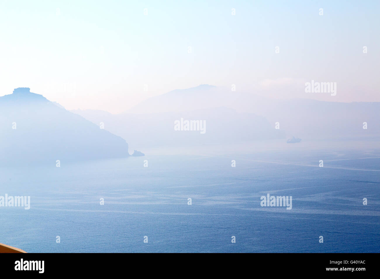 in the cyclades sea of greece sun light and backlight from the clouds ...