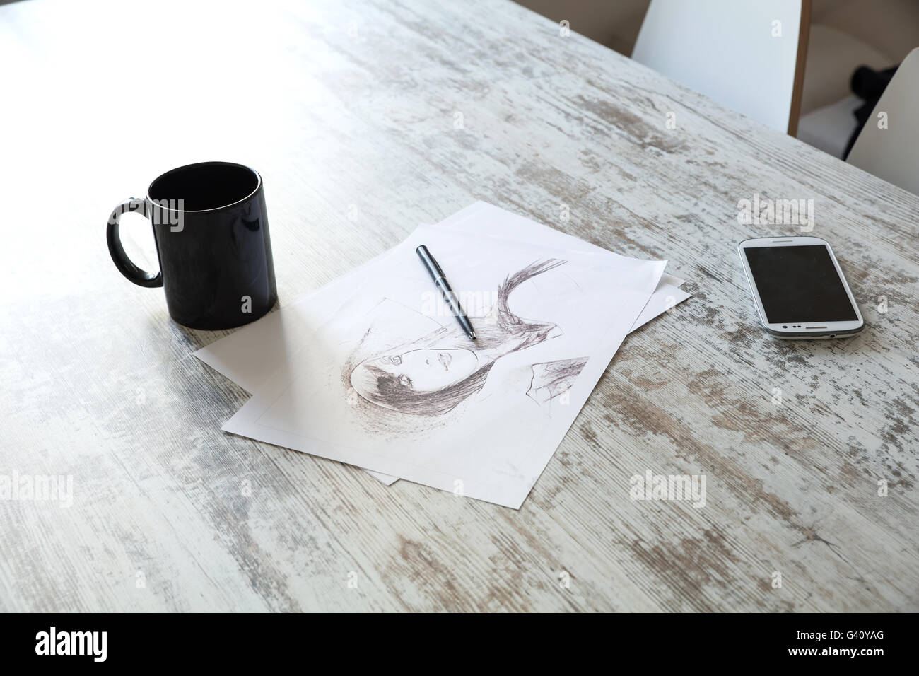 Drawing a sketch on the Table Stock Photo - Alamy