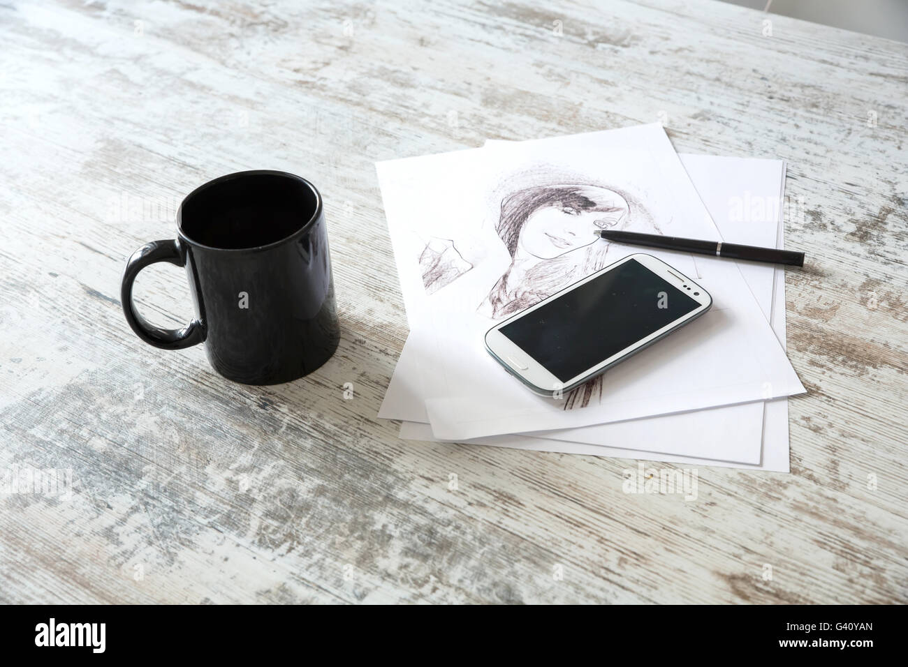 Drawing a sketch on the Table Stock Photo - Alamy