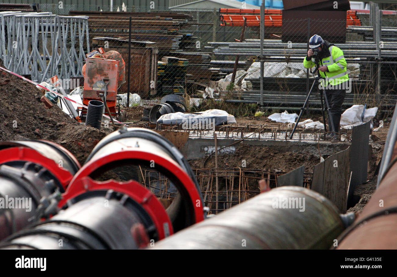 A photographer takes pictures of the scene at offshore Engineering firm ...