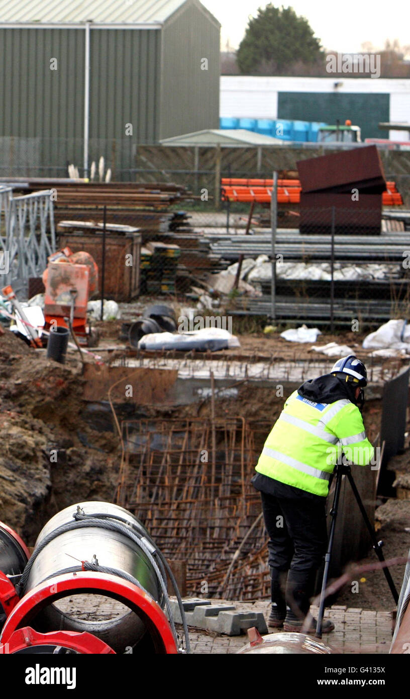 A photographer takes pictures of the scene at offshore Engineering firm ...